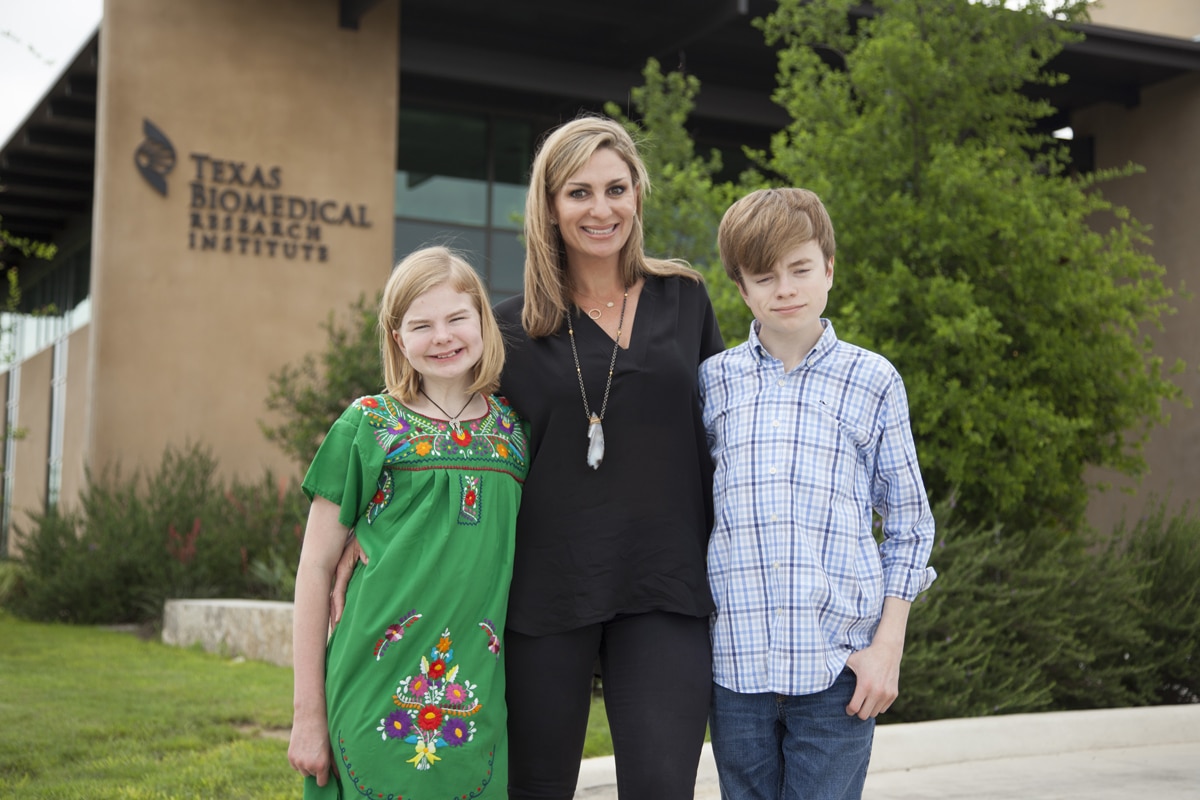Azar Family with Scientists - Texas Biomedical Research Institute